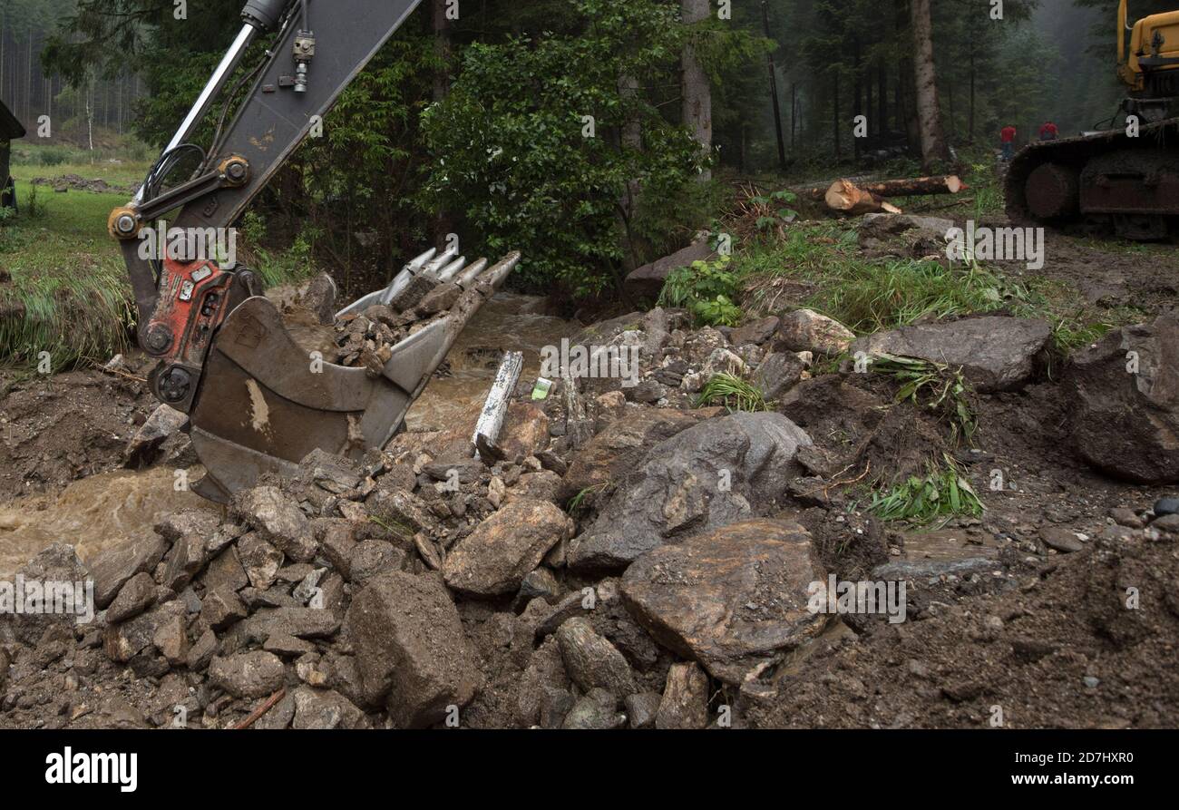 storm damage caused by mudslides, debris and mud after heavy rainfalls ...