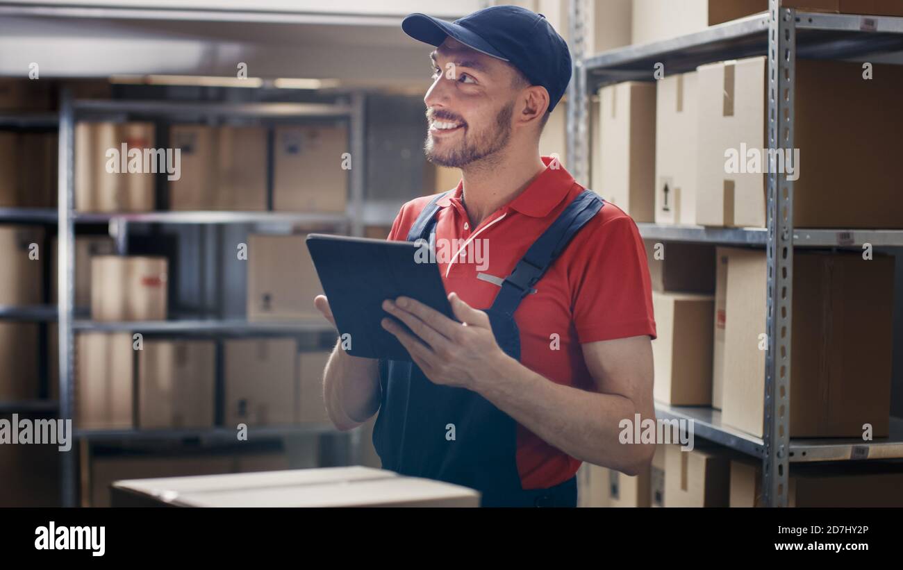 Warehouse Worker Uses Digital Tablet For Checking Stock, On the Shelves ...