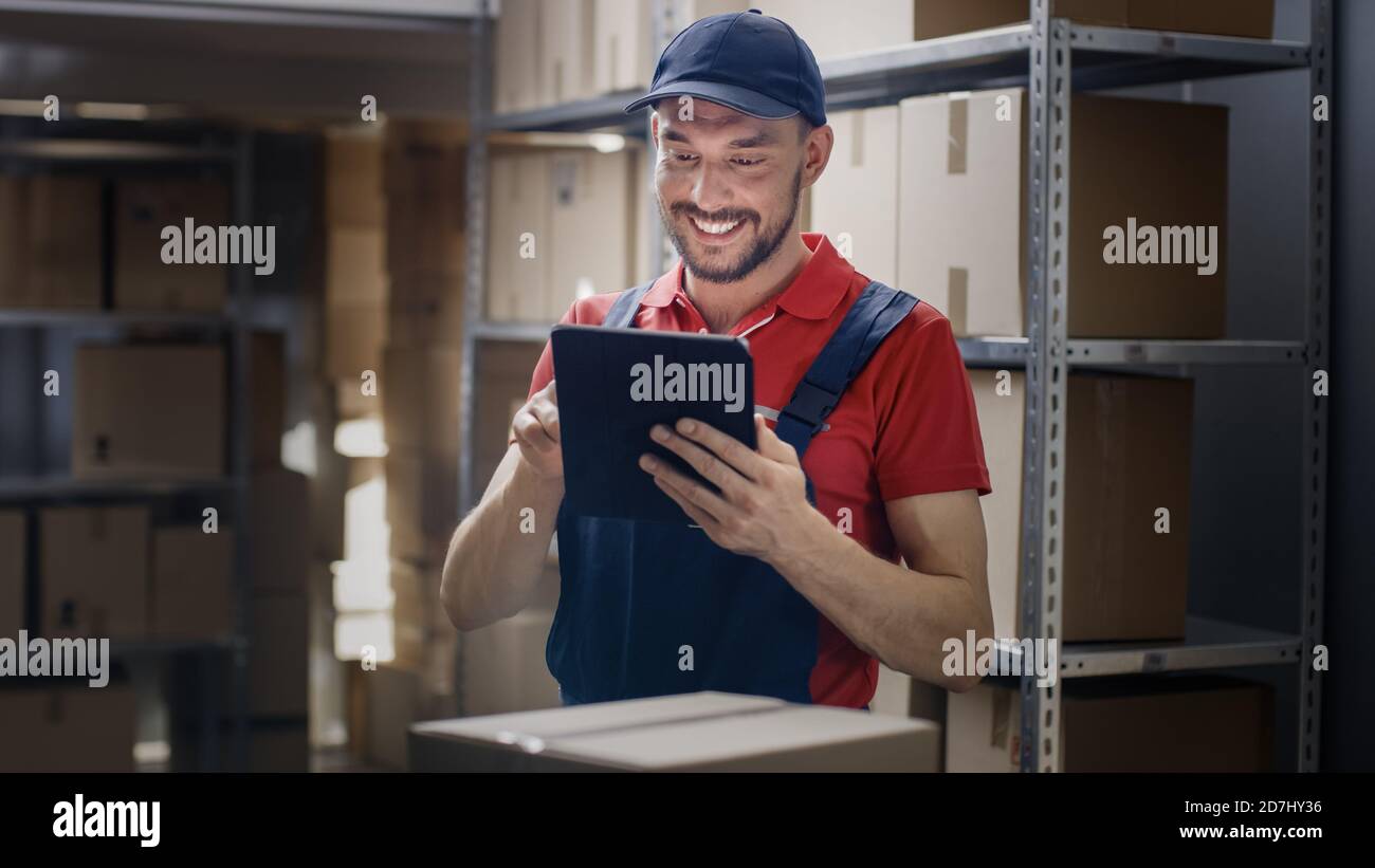 Warehouse Worker Uses Digital Tablet For Checking Stock, On the Shelves ...