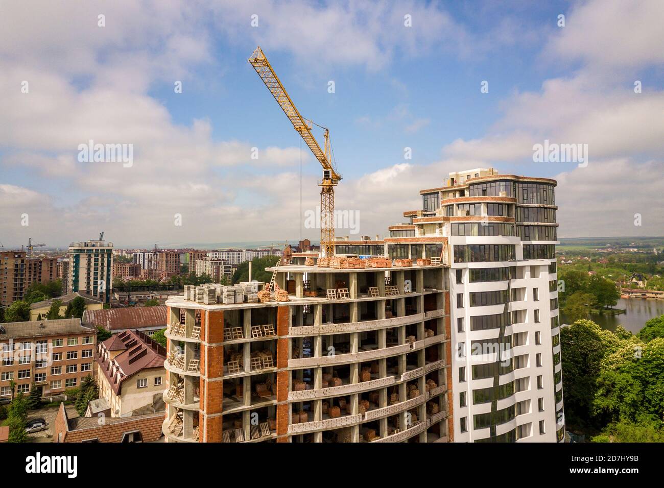 Apartment or office tall building under construction. Brick walls ...