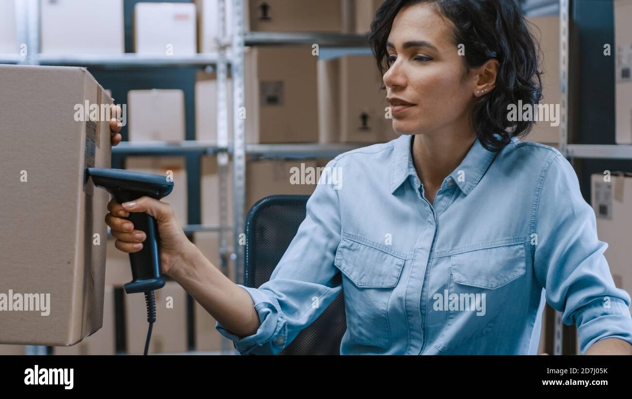 Female Inventory Manager Scans Cardboard Box and Digital Tablet with Barcode Scanner, Worker ...