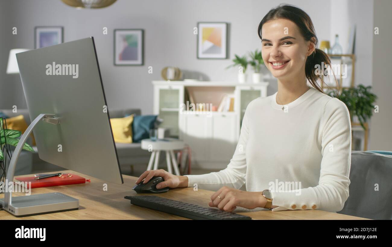 Portrait Shot of the Beautiful Young Woman Working on Personal Computer ...