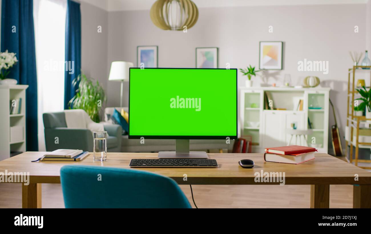 Modern Personal Computer with Mock-up Green Screen Display Standing on ...