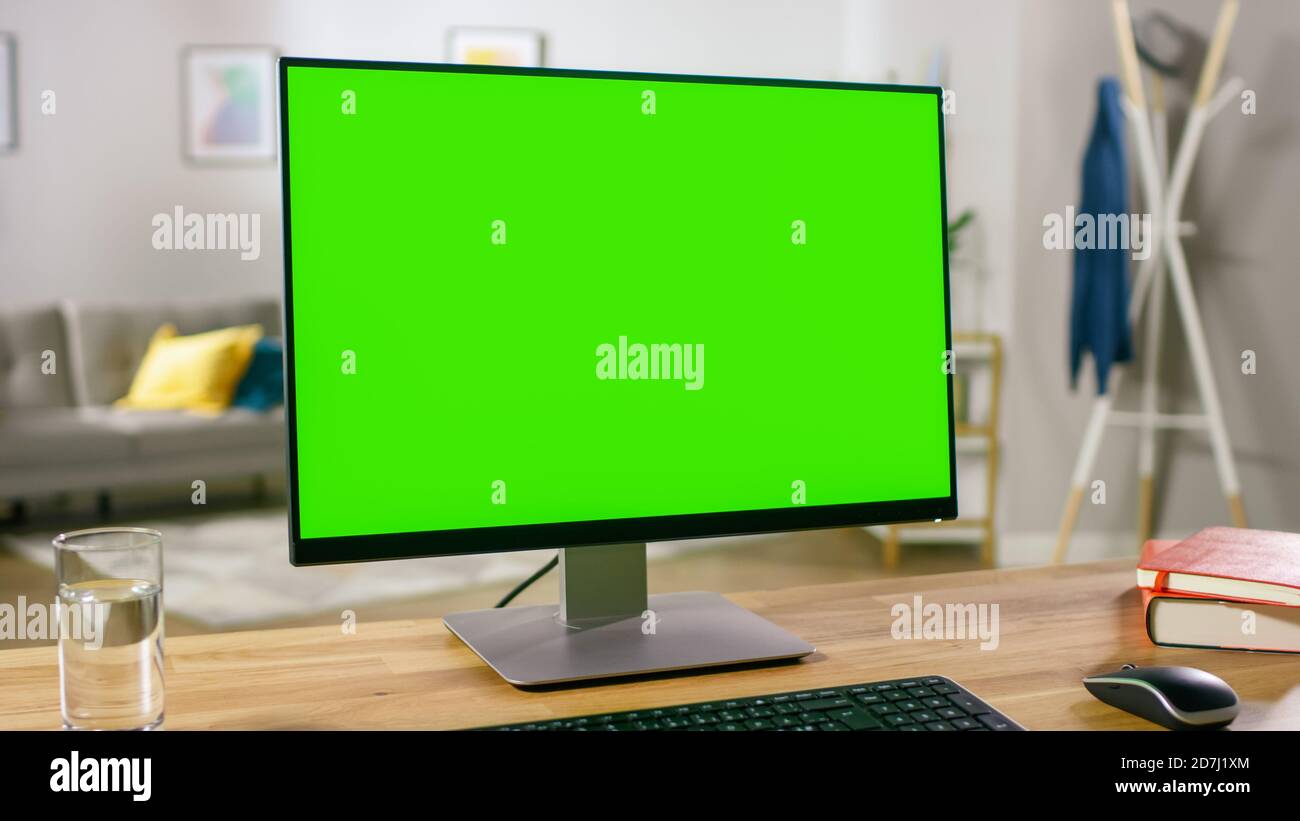 Modern Personal Computer with Mock-up Green Screen Display Standing on ...