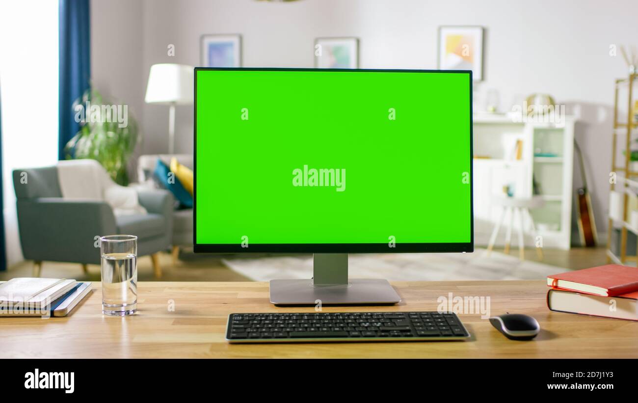 Modern Personal Computer with Mock-up Green Screen Display Standing on ...