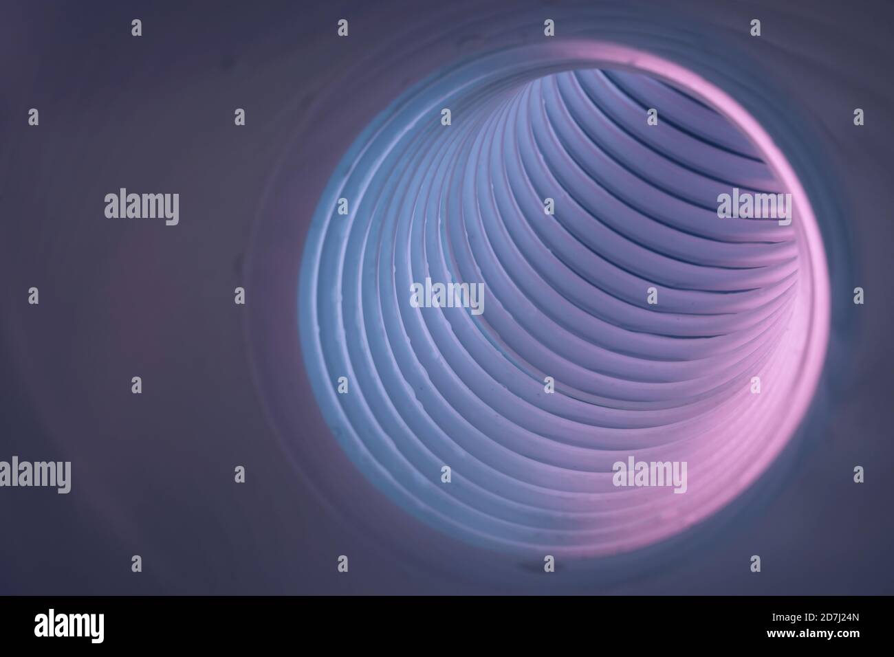 Beautiful round abstract white-gray tunnel with color light on a ...