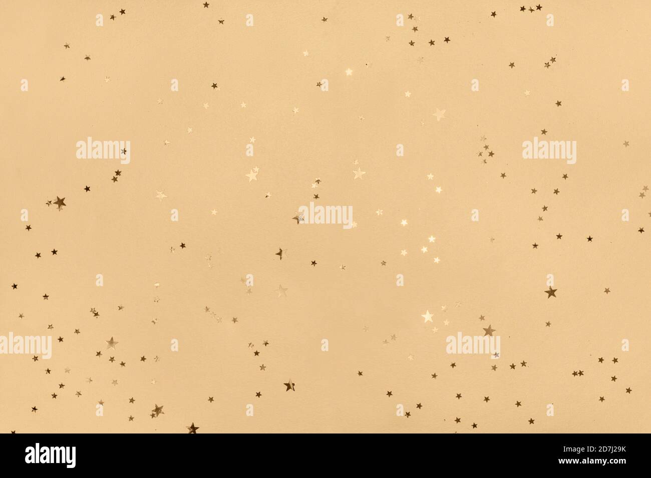 Scattered glitter on a biege color background, Christmas, New year ...