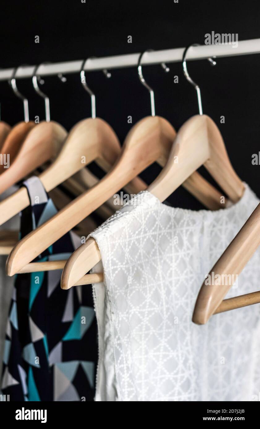 colorful dress hanging on cloth rack in a row Stock Photo - Alamy