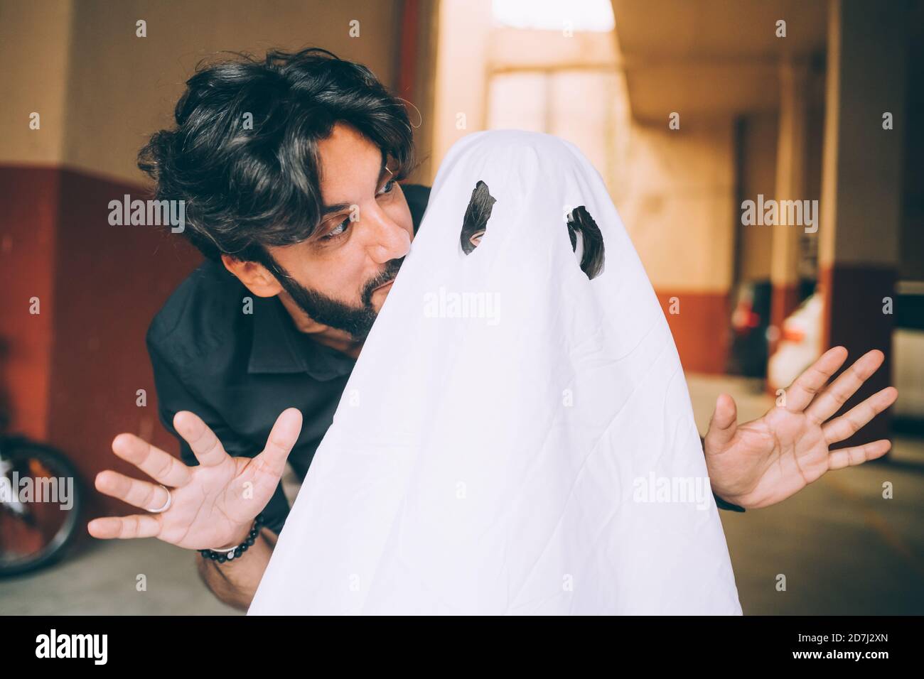Father with child dressed as ghost Stock Photo - Alamy