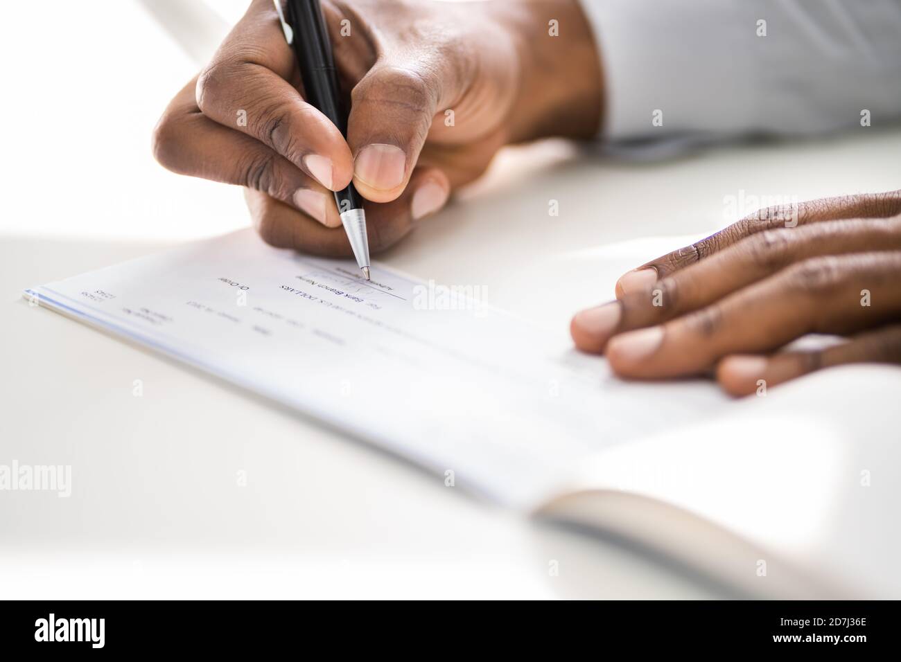 African American Writing Cheque. Signing Paycheck Or Money Check Stock ...