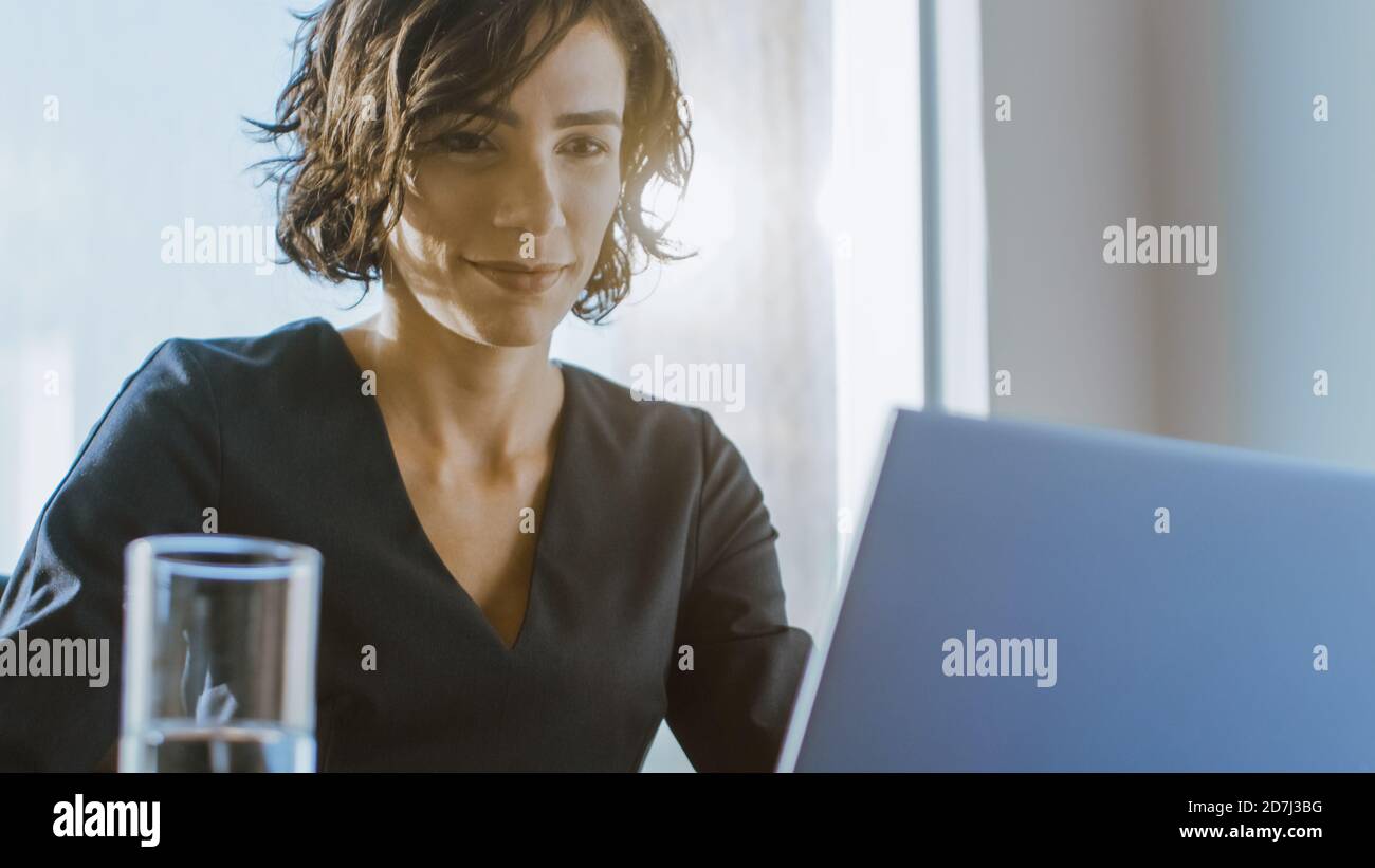Portrait of the Focused Female CEO Working on a Laptop. Happy ...