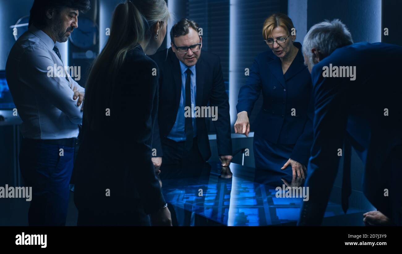 Diverse Team of Government Intelligence Agents Standing Around Digital ...