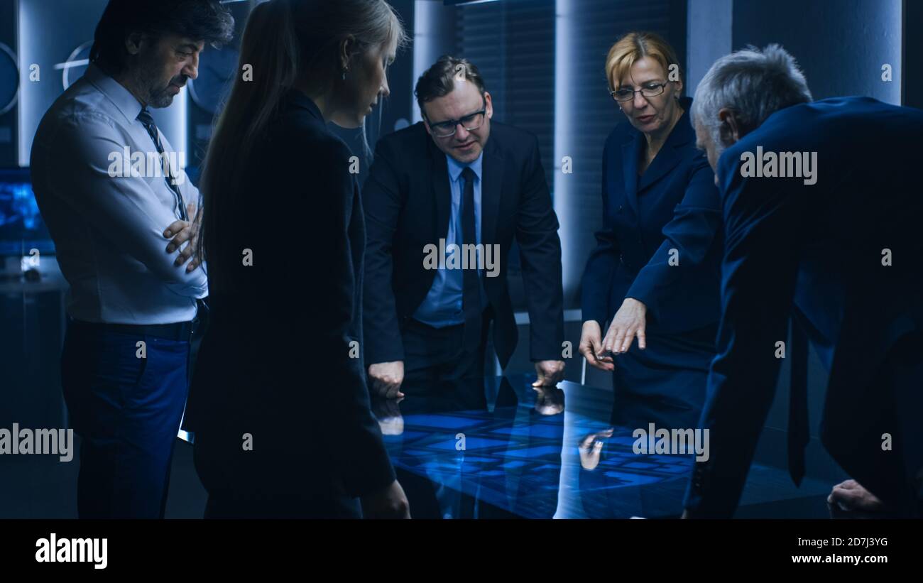 Diverse Team of Government Intelligence Agents Standing Around Digital ...