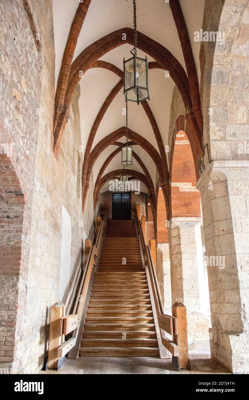 Medieval arch with stone bricks wall and columns in the center of ...