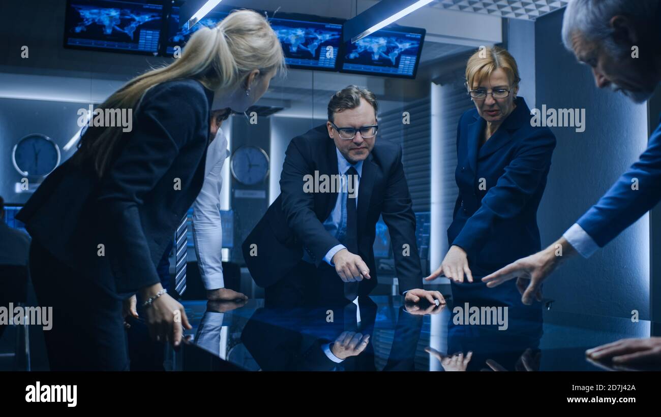 Diverse Team of Government Intelligence Agents Standing Around Digital ...