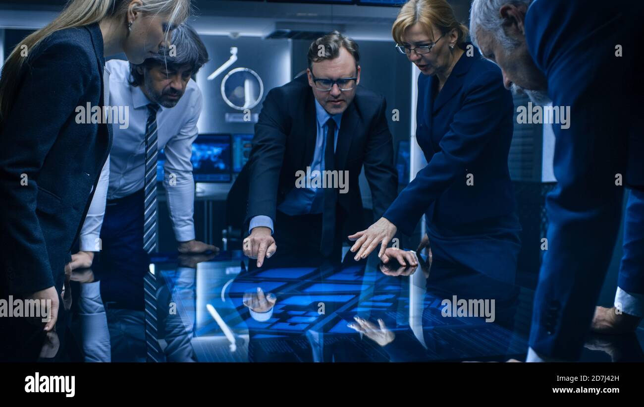 Diverse Team of Government Intelligence Agents Standing Around Digital ...