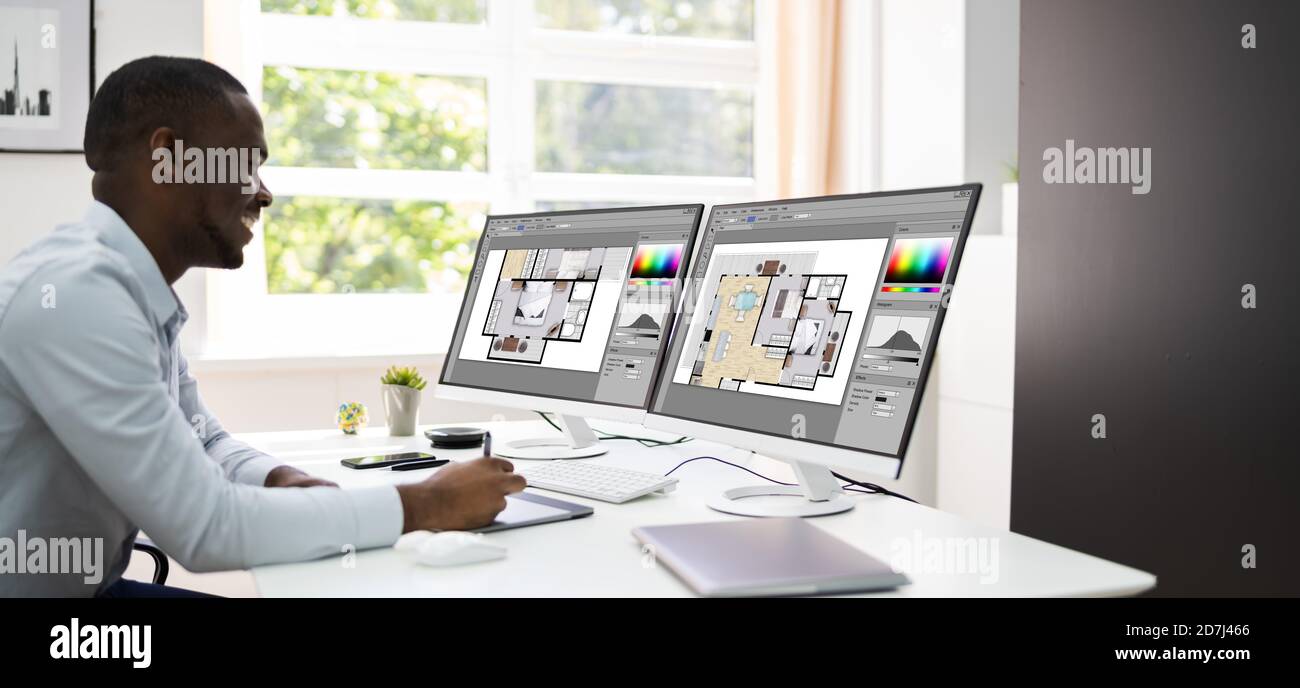 Professional editor using retouching software hi-res stock photography ...