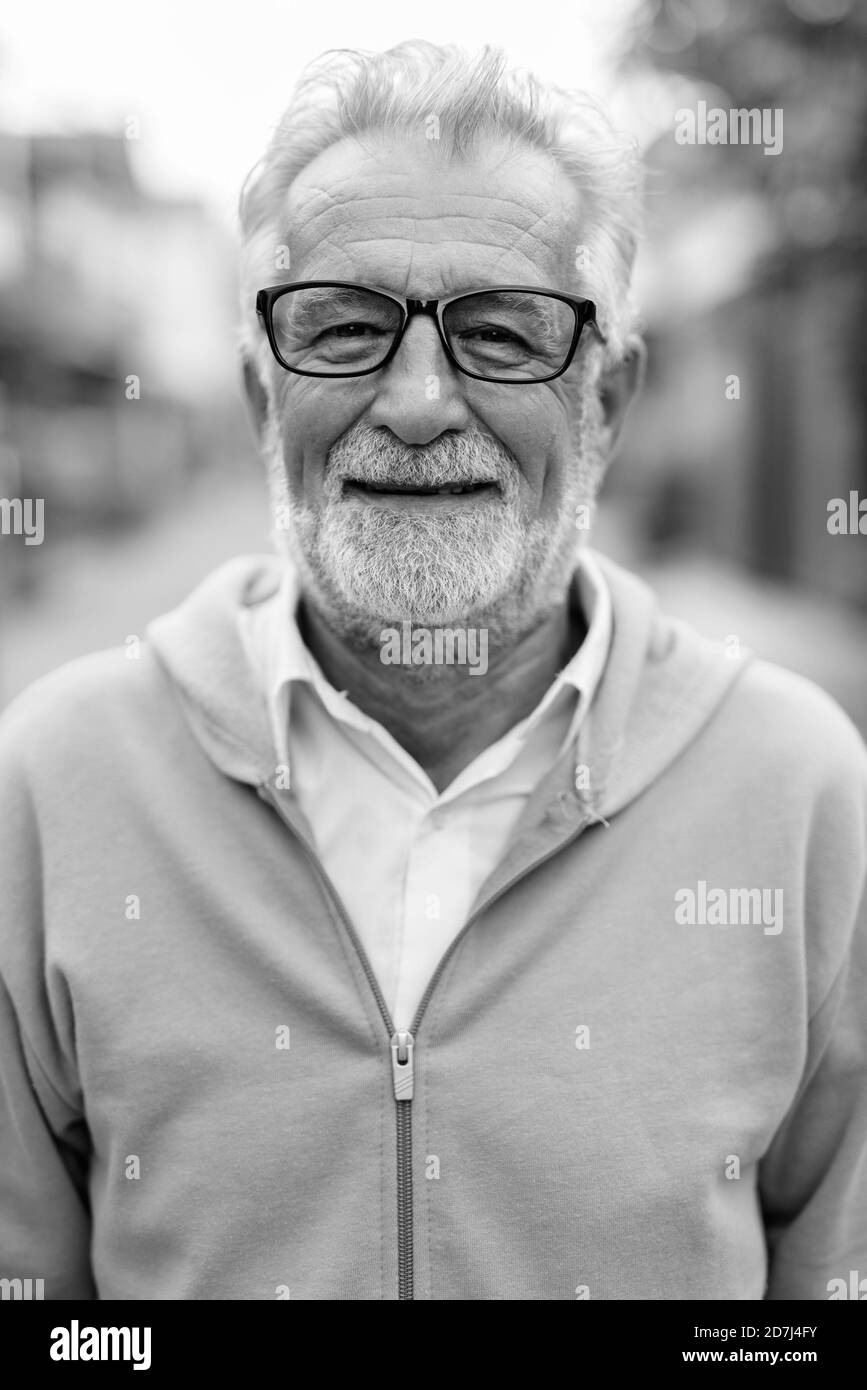 Face Of Happy Handsome Senior Bearded Man Smiling While Wearing Jacket