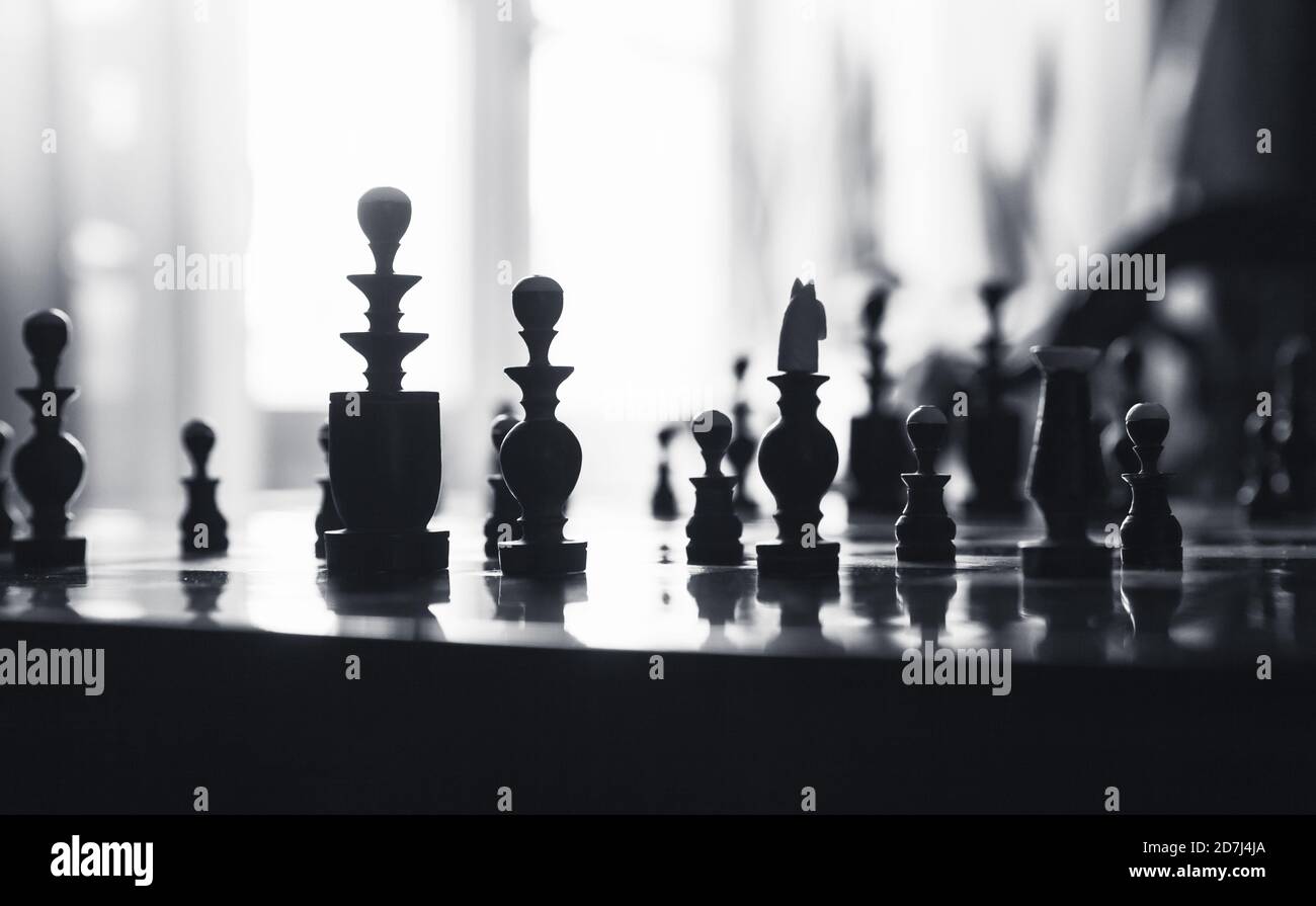 Shiny retro chess board with chessmen. Close-up monochrome photo with ...