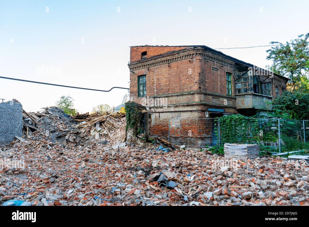 Dismantled building. A mountain of bricks. Destruction of buildings ...