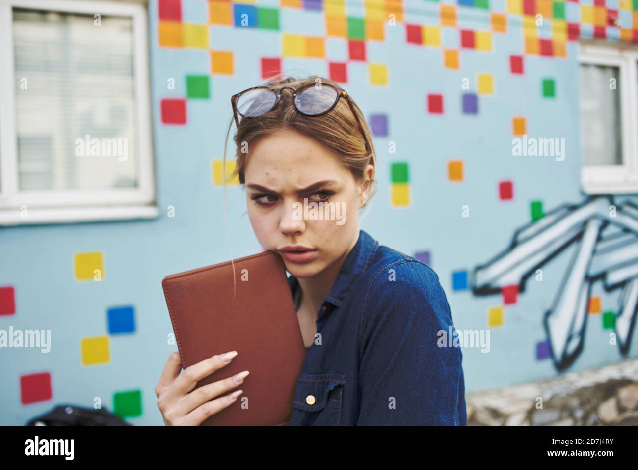 Business woman with notepad in hands outdoors building walk lifestyle ...