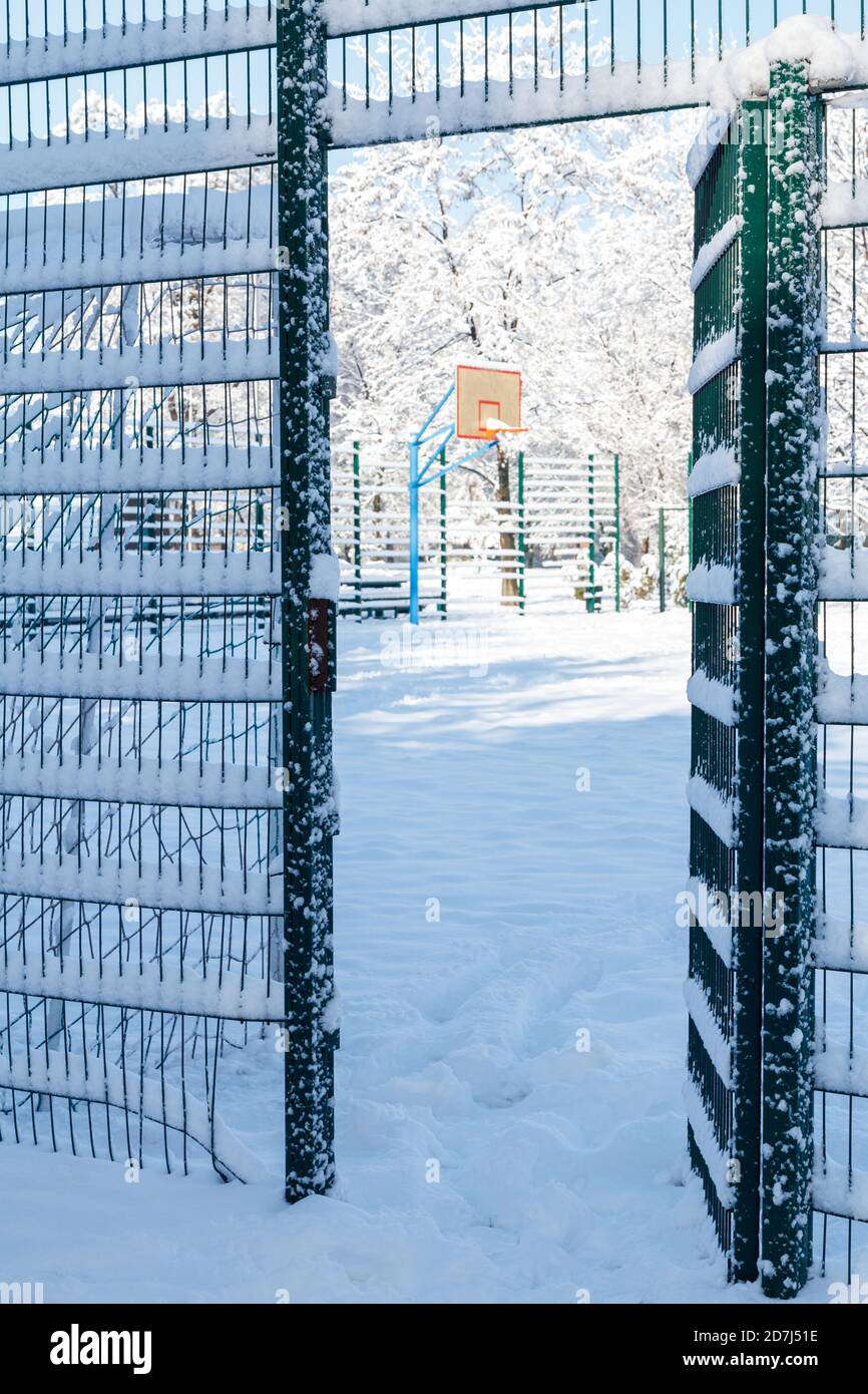 Entry on sports ground covered the snow in the sunny winter day Stock ...