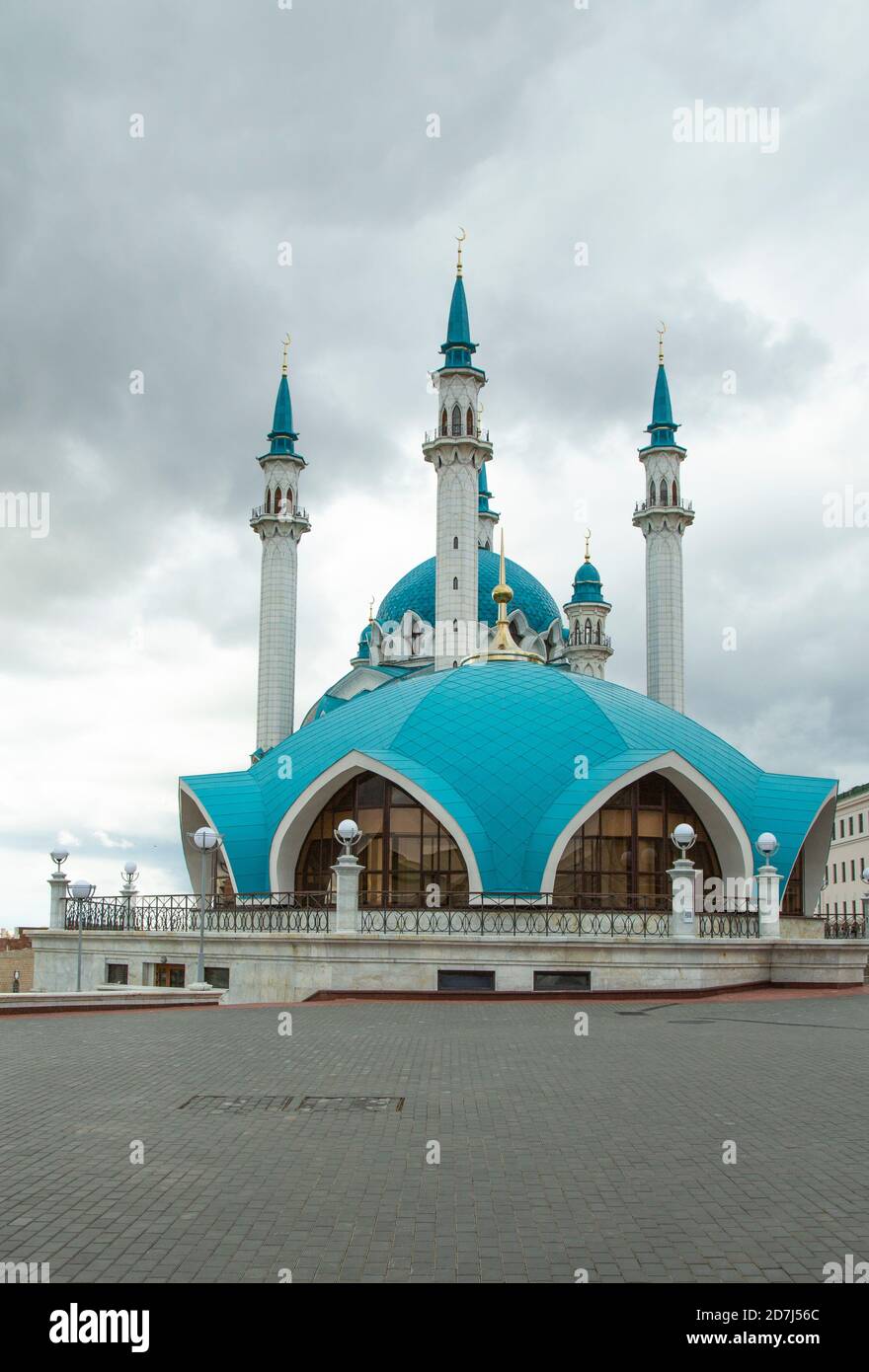 Beautiful white mosque with a blue roof against the sky with clouds ...