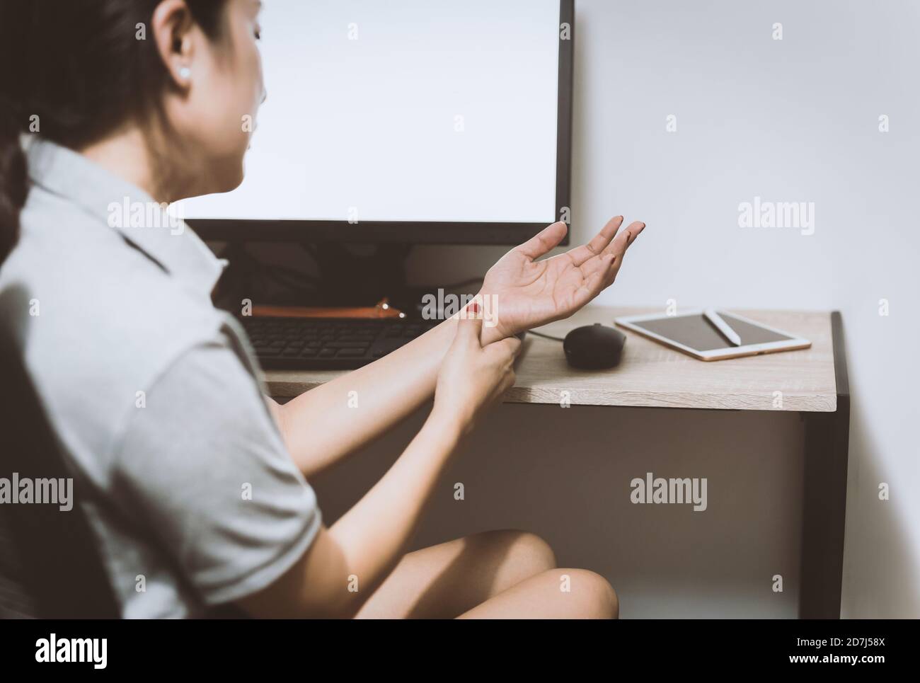 Woman having office syndrome injury on her wrist from working on ...