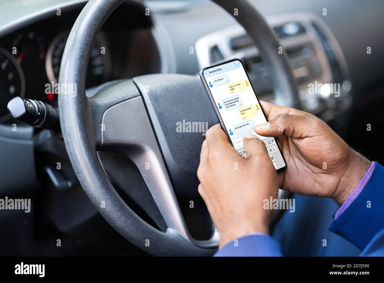 Distracted African Man Texting On Mobile Phone While Driving Stock ...