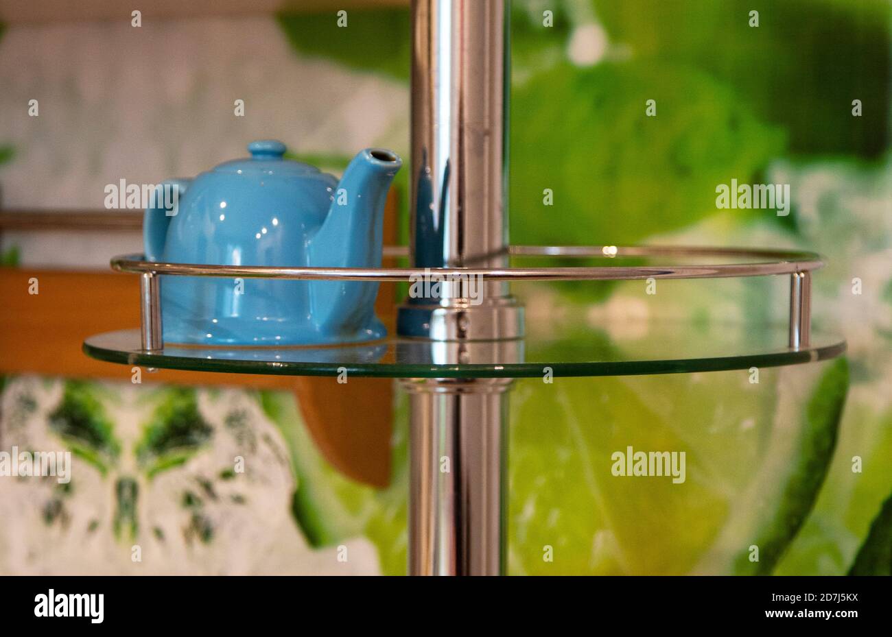 Small blue ceramic teapot for serving hot tea. Teapot in the kitchen ...