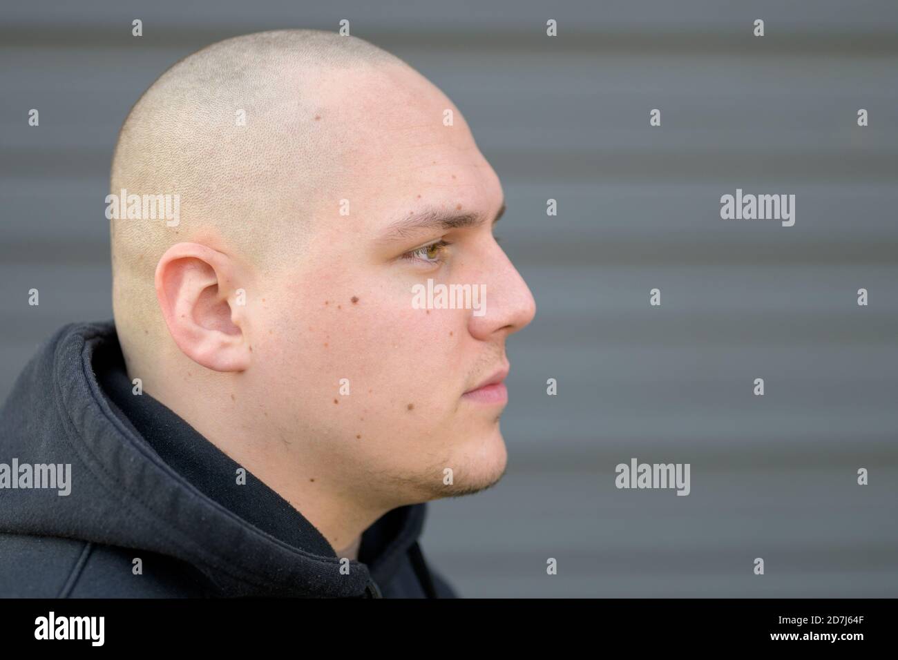 Serious shaved head man hi-res stock photography and images - Alamy