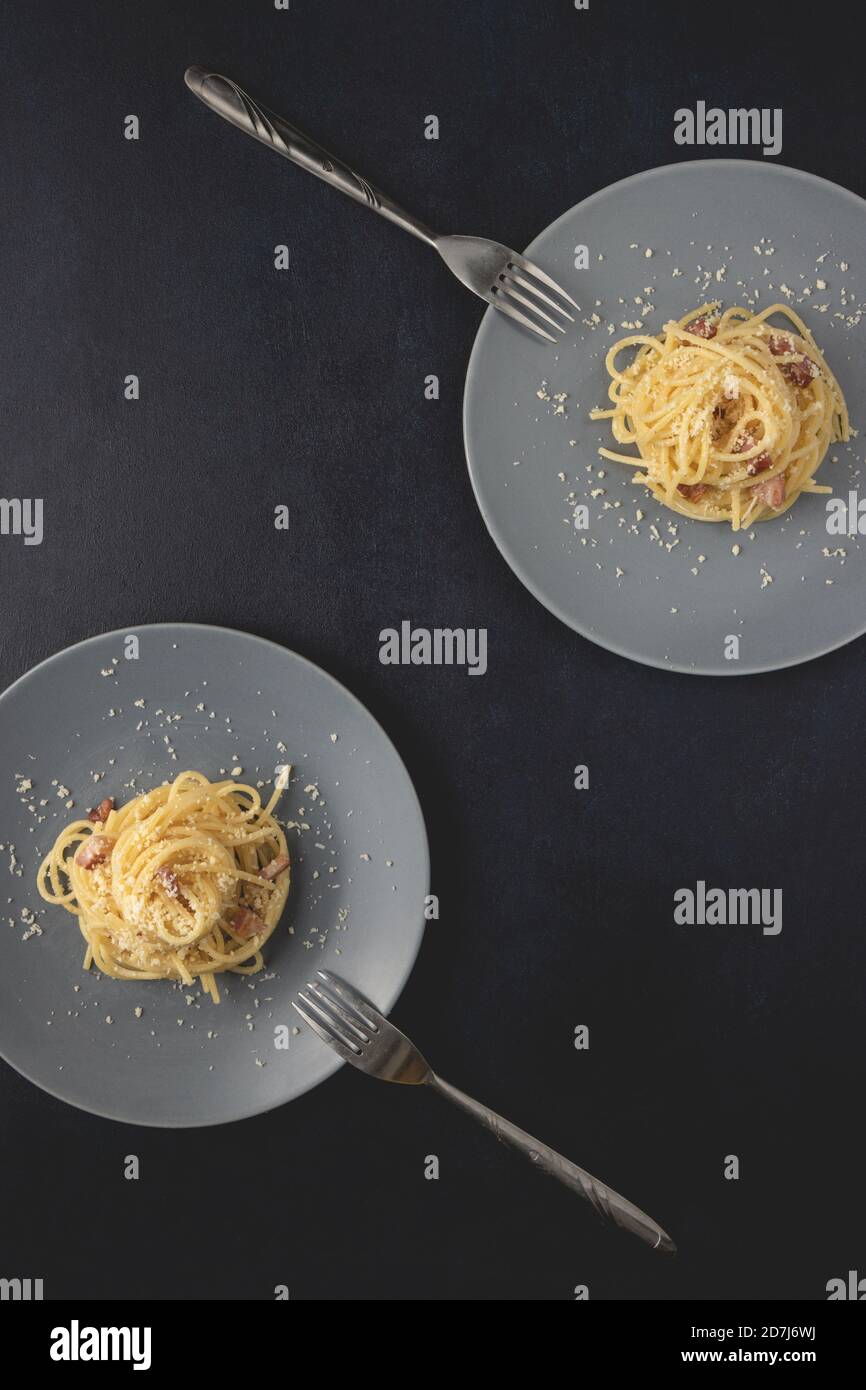 Two portions of Spaghetti traditional Italian dish spaghetti carbonara ...