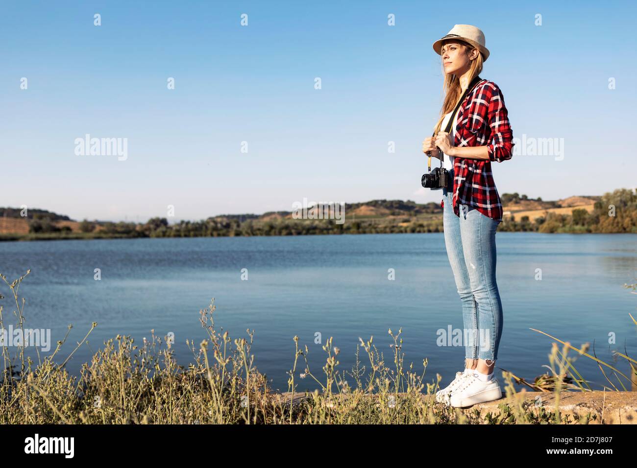 Woman standing to camera hi-res stock photography and images - Alamy