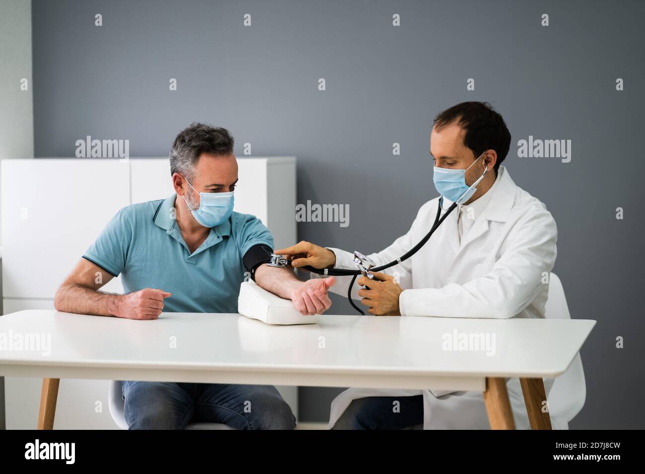 Elderly man measures blood pressure hi-res stock photography and images ...