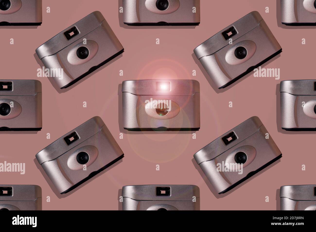 Retro cameras over pink background Stock Photo - Alamy