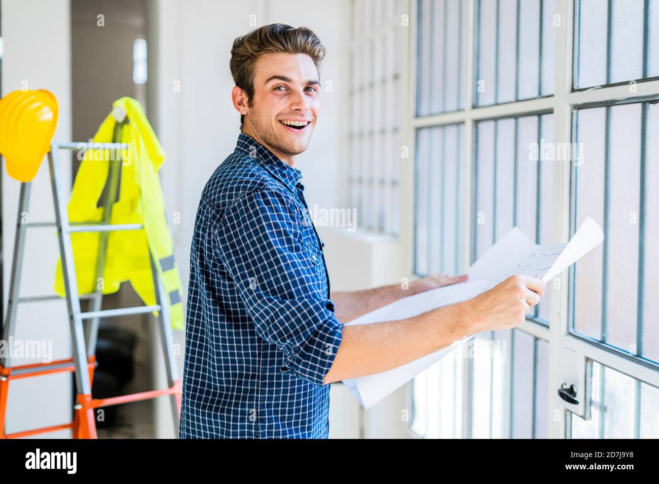 Man holding blueprint hi-res stock photography and images - Alamy