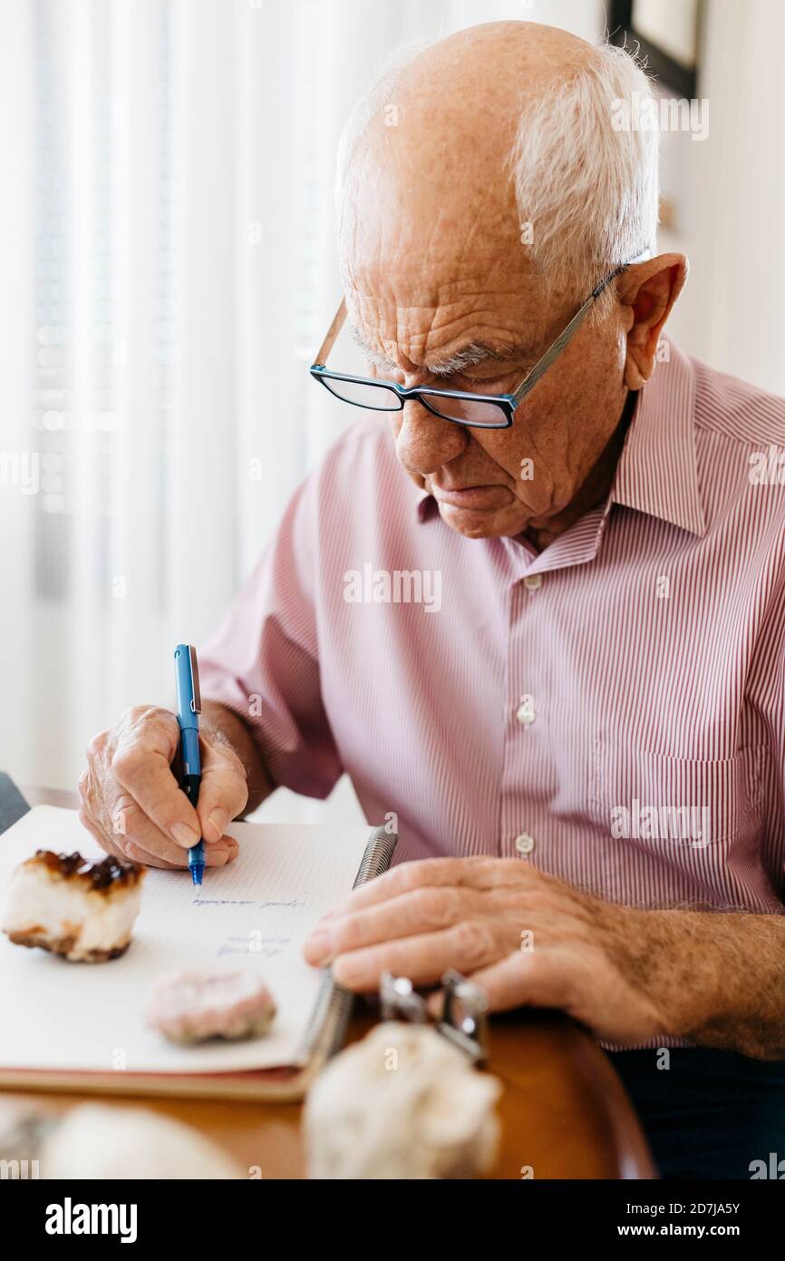 Man writing in book hi-res stock photography and images - Alamy