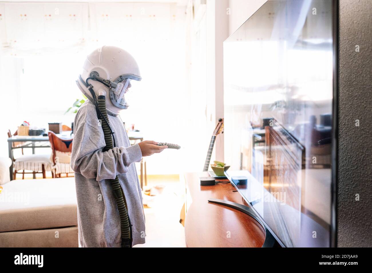 Boy wearing space helmet standing hi-res stock photography and images ...