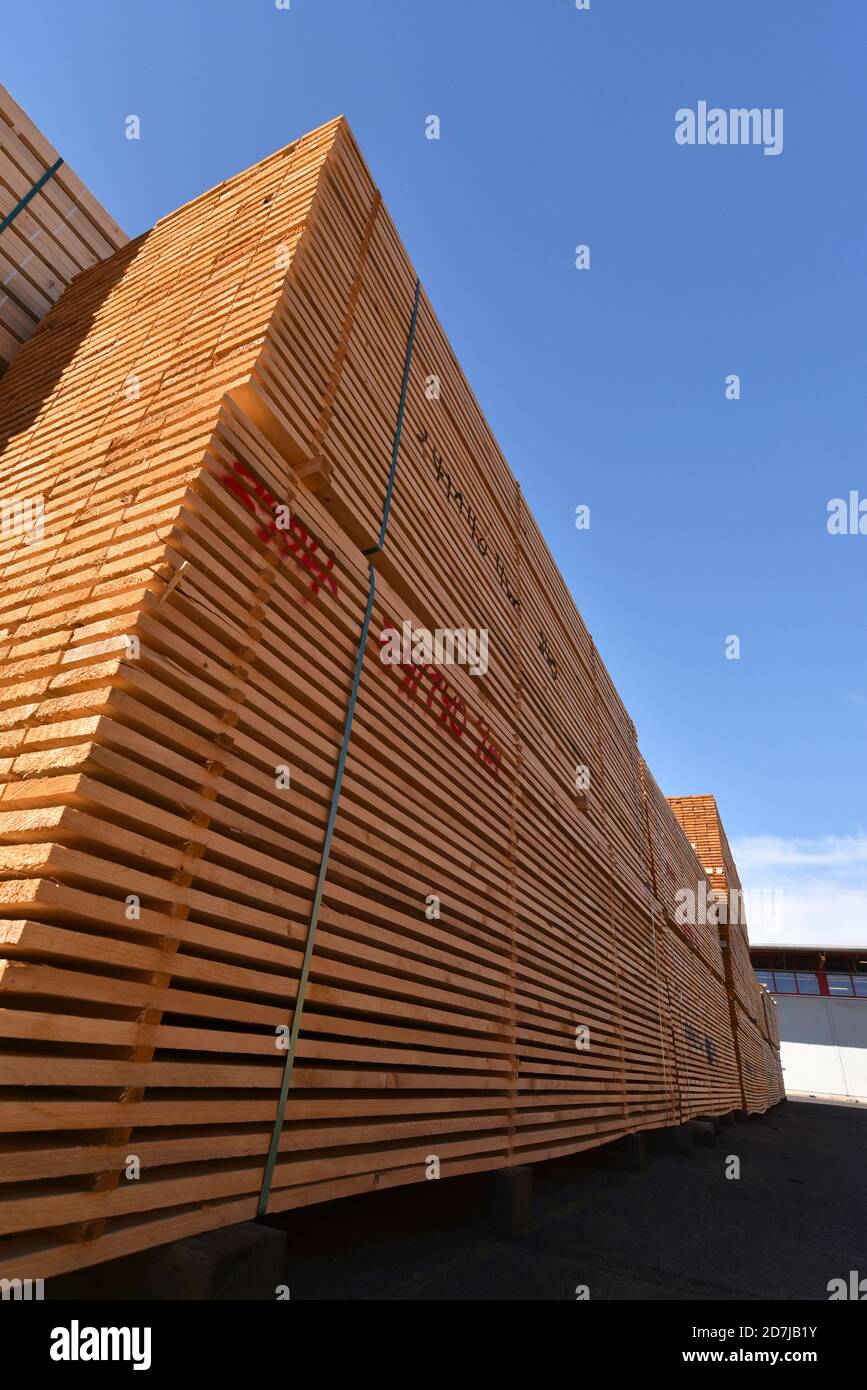 Planks stacked in lumberyard Stock Photo - Alamy