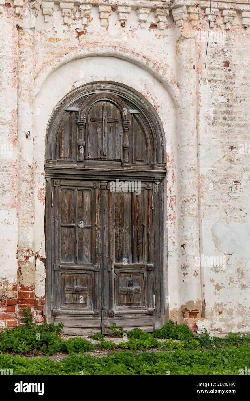 Weathered gate of abandoned brick church at countryside Stock Photo - Alamy