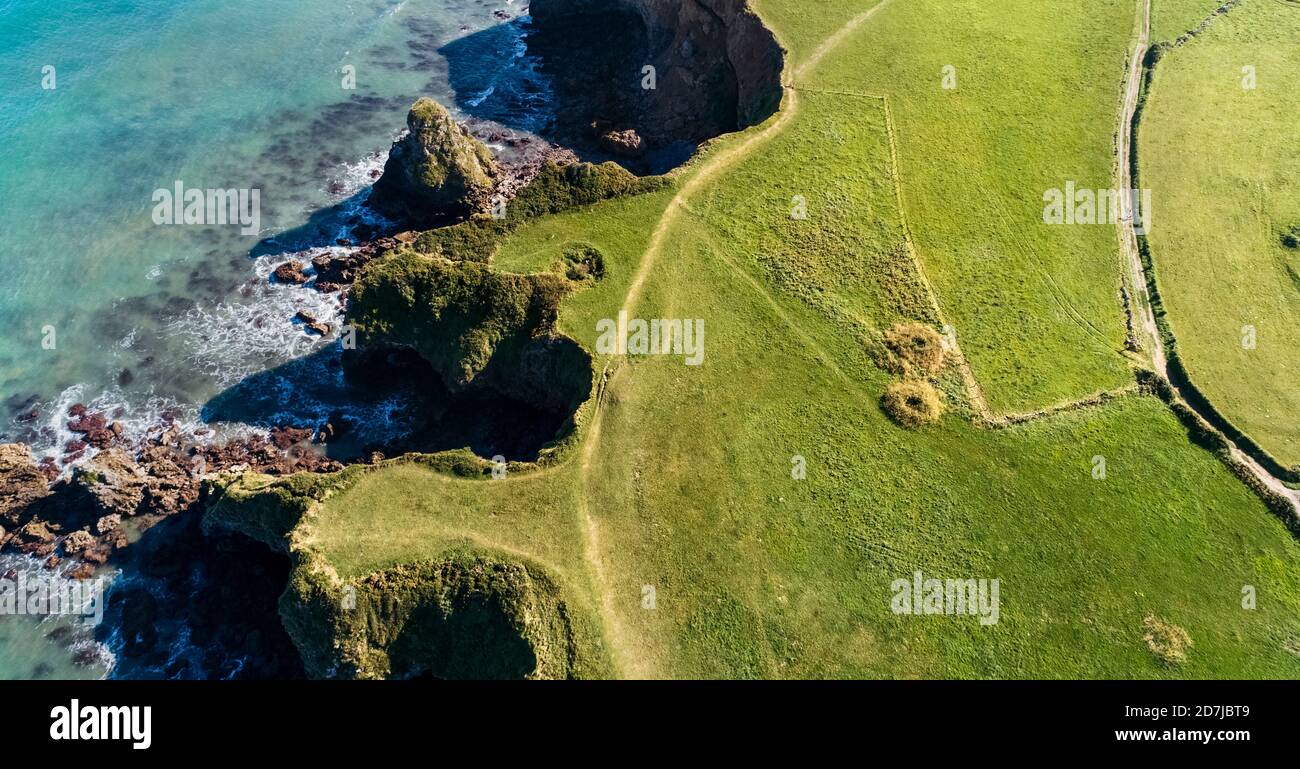 Aerial view of green grassy coastal cliffs Stock Photo - Alamy