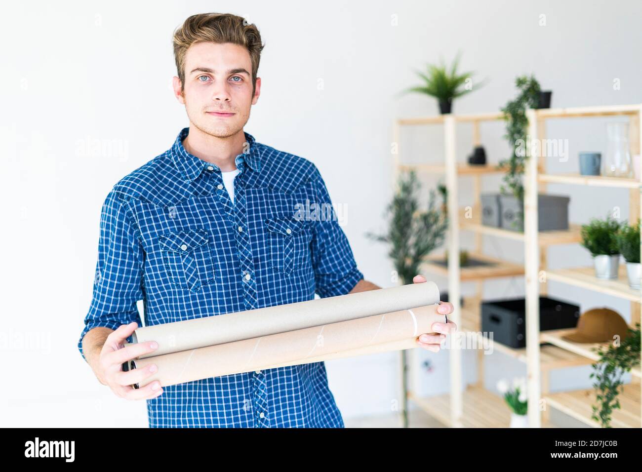 Man holding blueprint hi-res stock photography and images - Alamy