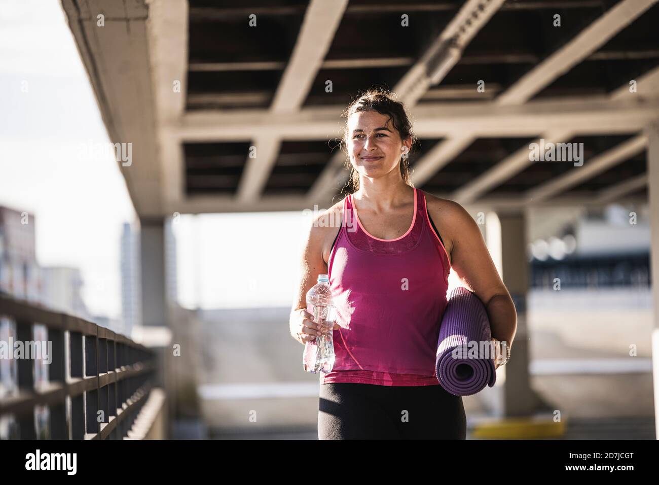 Confident young woman walking hi-res stock photography and images - Alamy