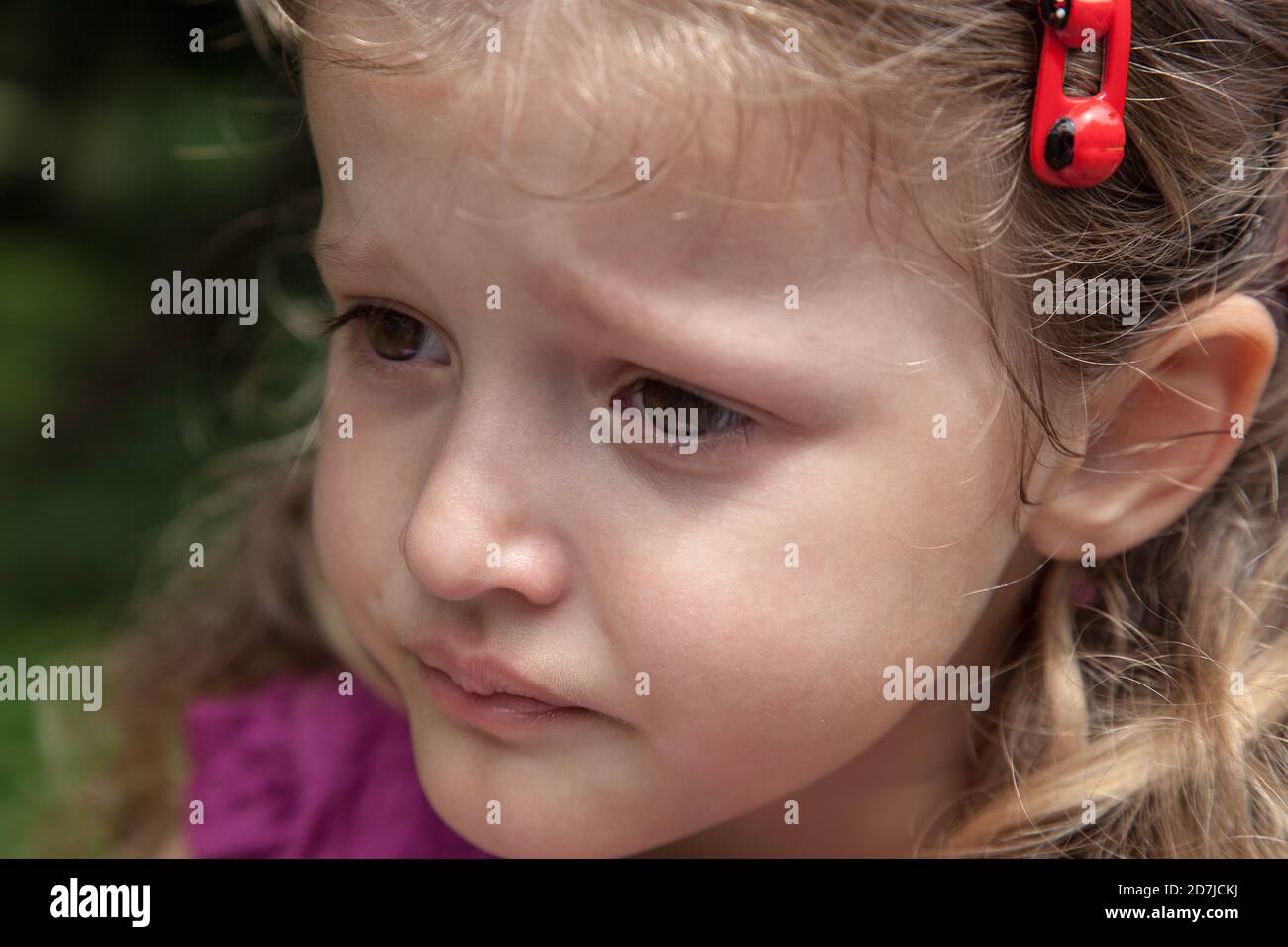 Cute little sad sad girl with tears in her eyes Stock Photo - Alamy