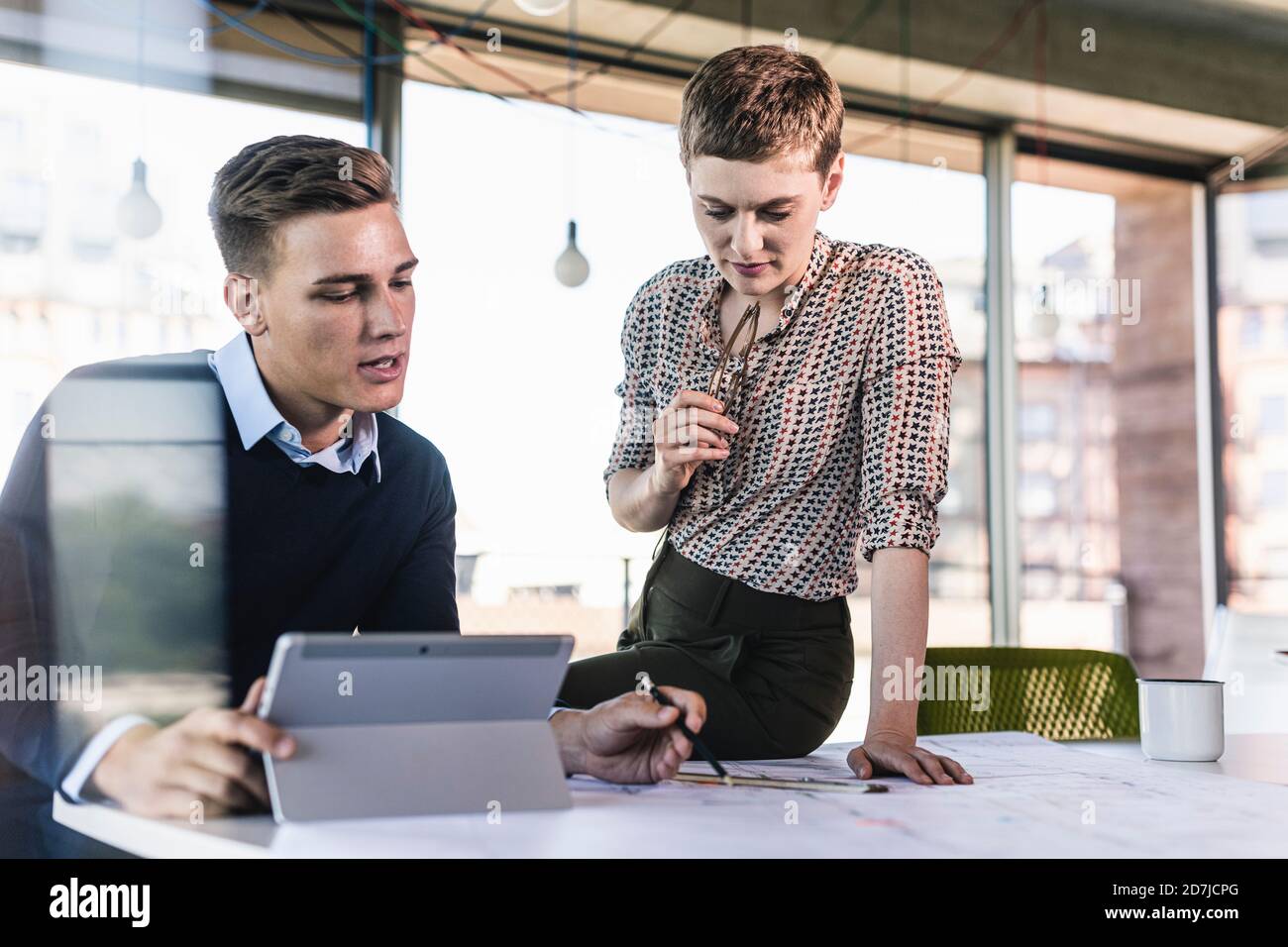 Businessman explaining document coworker hi-res stock photography and ...