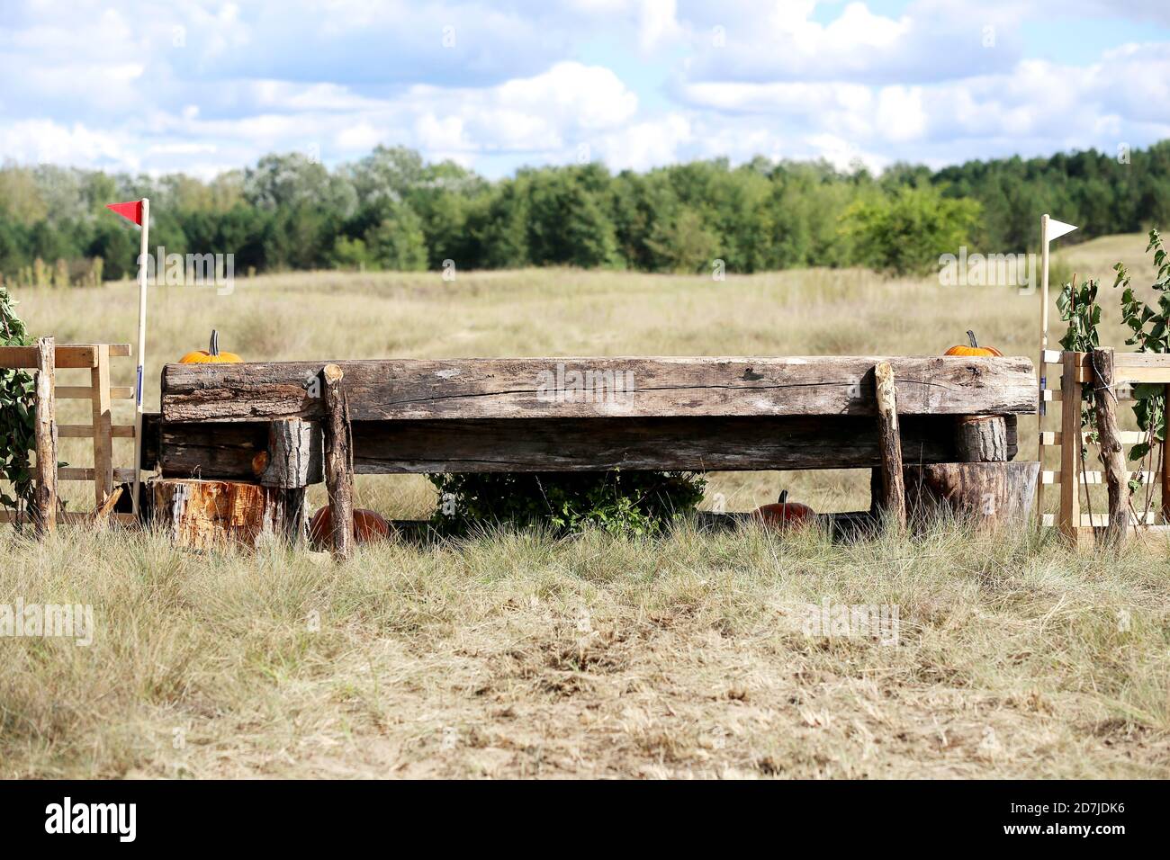Photo of eventing equestrian rider jumping log barrier Stock Photo - Alamy