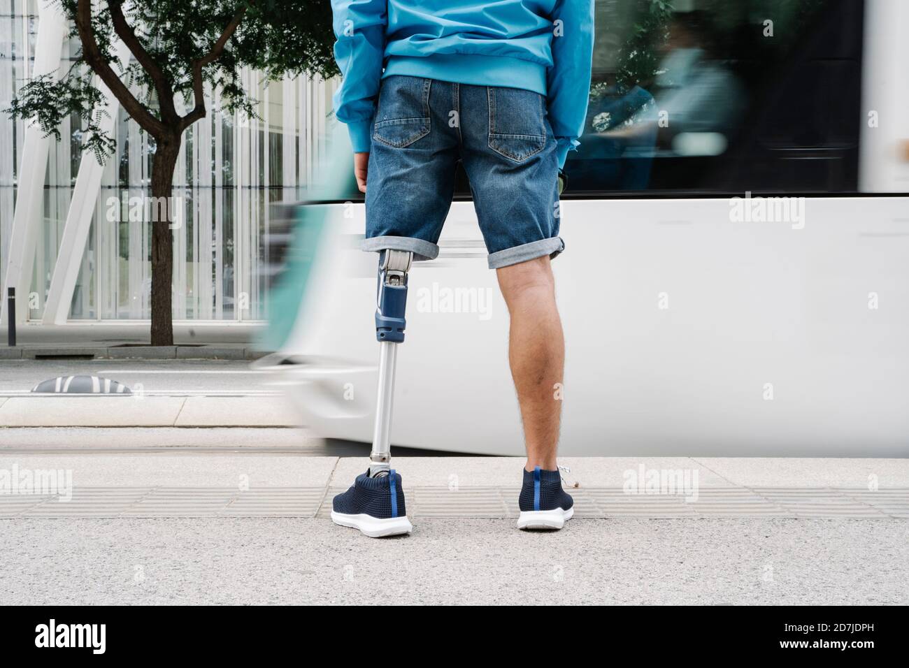 Man standing at railroad station platform against moving train Stock ...