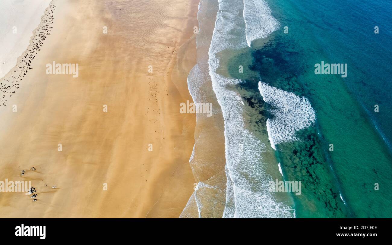 Aerial view of edge of sandy coastal beach Stock Photo - Alamy