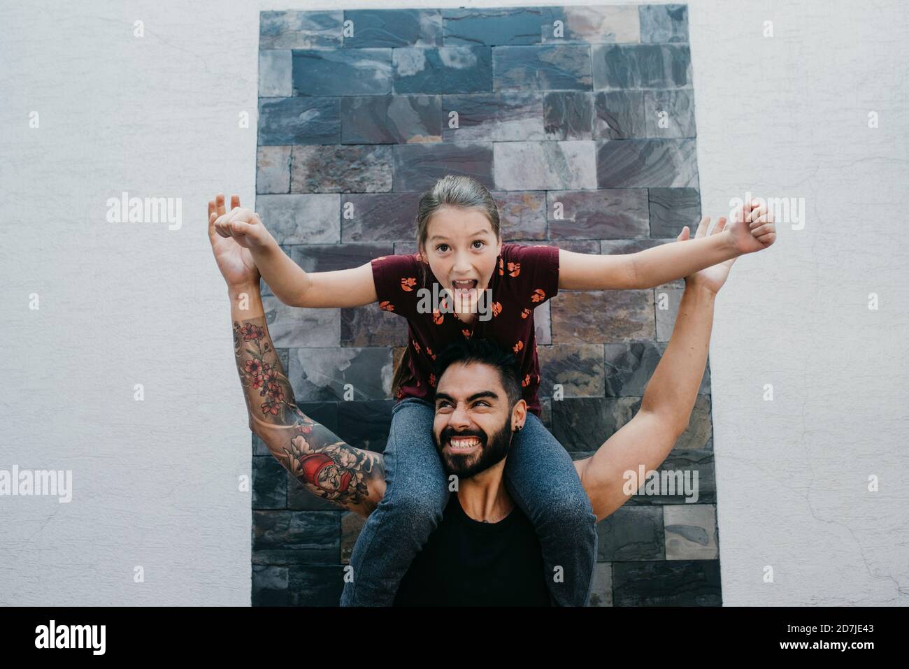 Child sitting on shoulder hi-res stock photography and images - Alamy