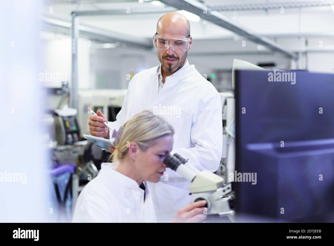 Scientist looking in microscope hi-res stock photography and images - Alamy
